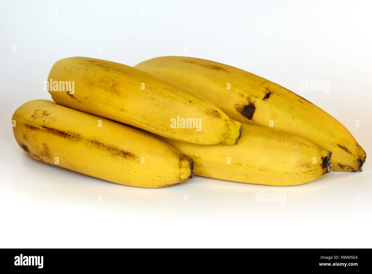Ripe almost brown bananas isolated Stock Photo - Alamy