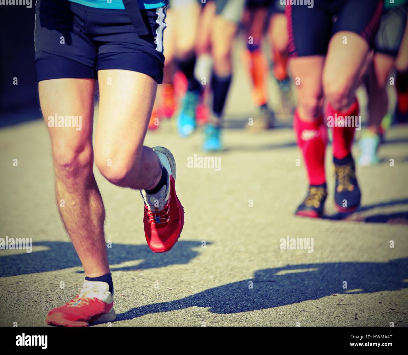 foot race with runners committed to win Stock Photo - Alamy