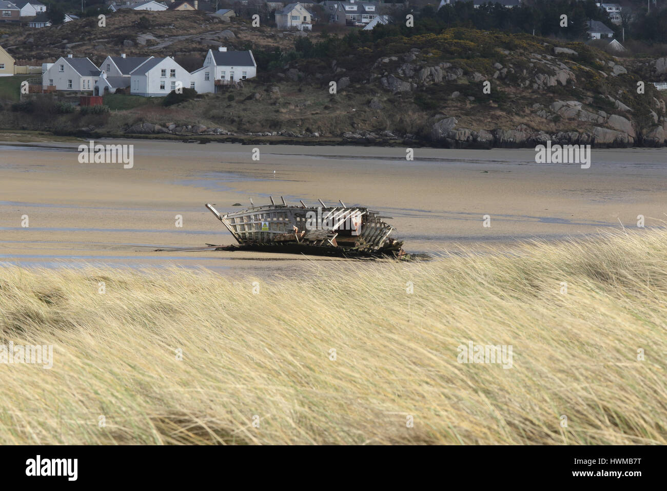 The wreck of a wooden fishing boat at Bunbeg, County Donegal, Ireland ...