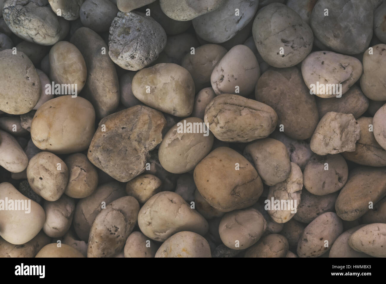 Small pebble rocks, pattern with gray tones Stock Photo - Alamy