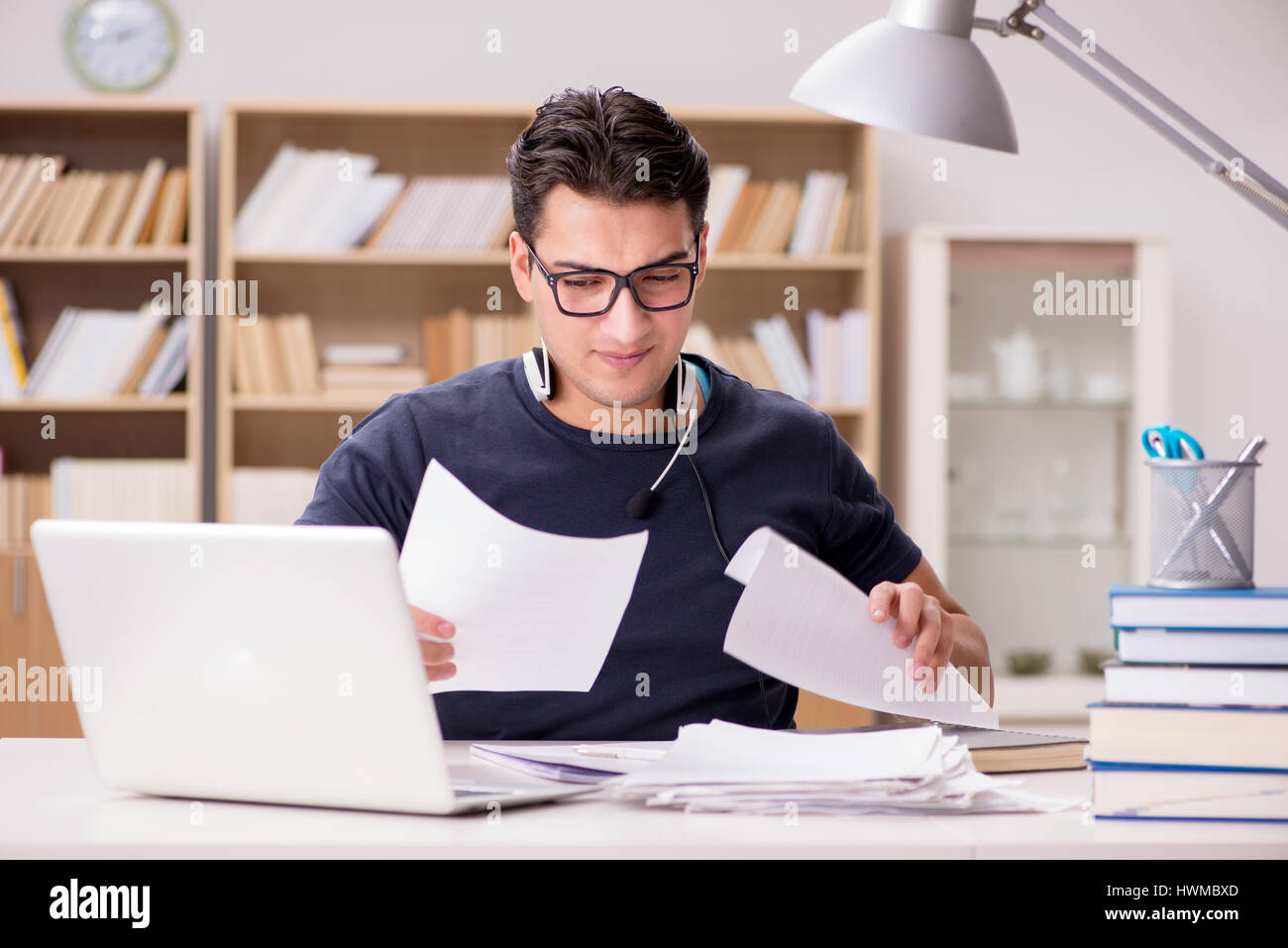 Angry man with too much paperwork to do Stock Photo - Alamy