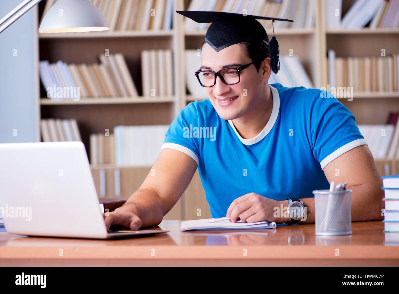 Young man graduating from university Stock Photo - Alamy