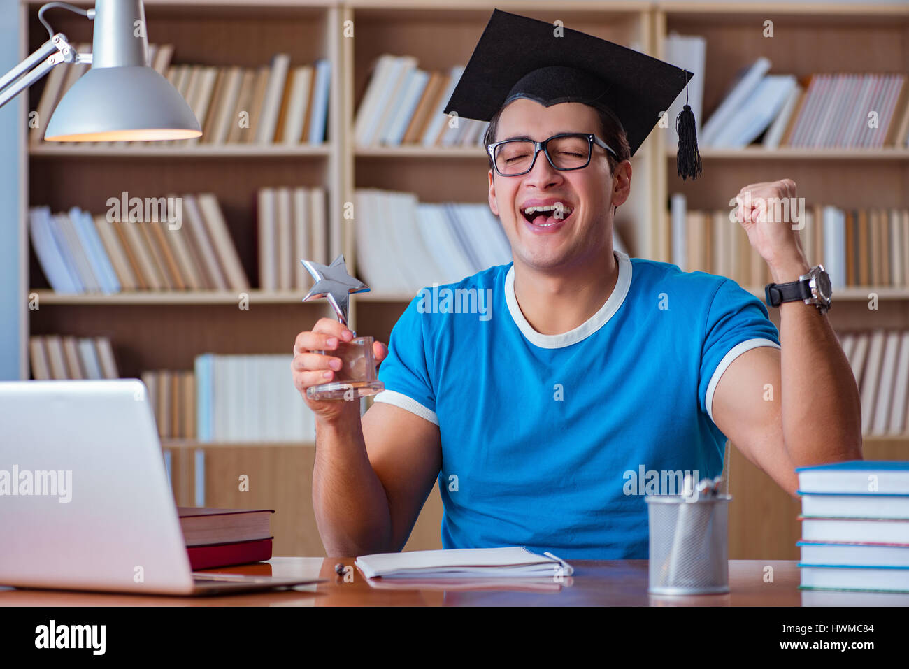 Young man graduating from university Stock Photo - Alamy