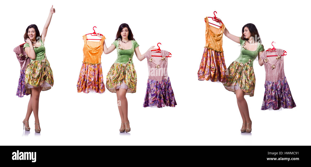 Woman trying to choose dress on white Stock Photo - Alamy