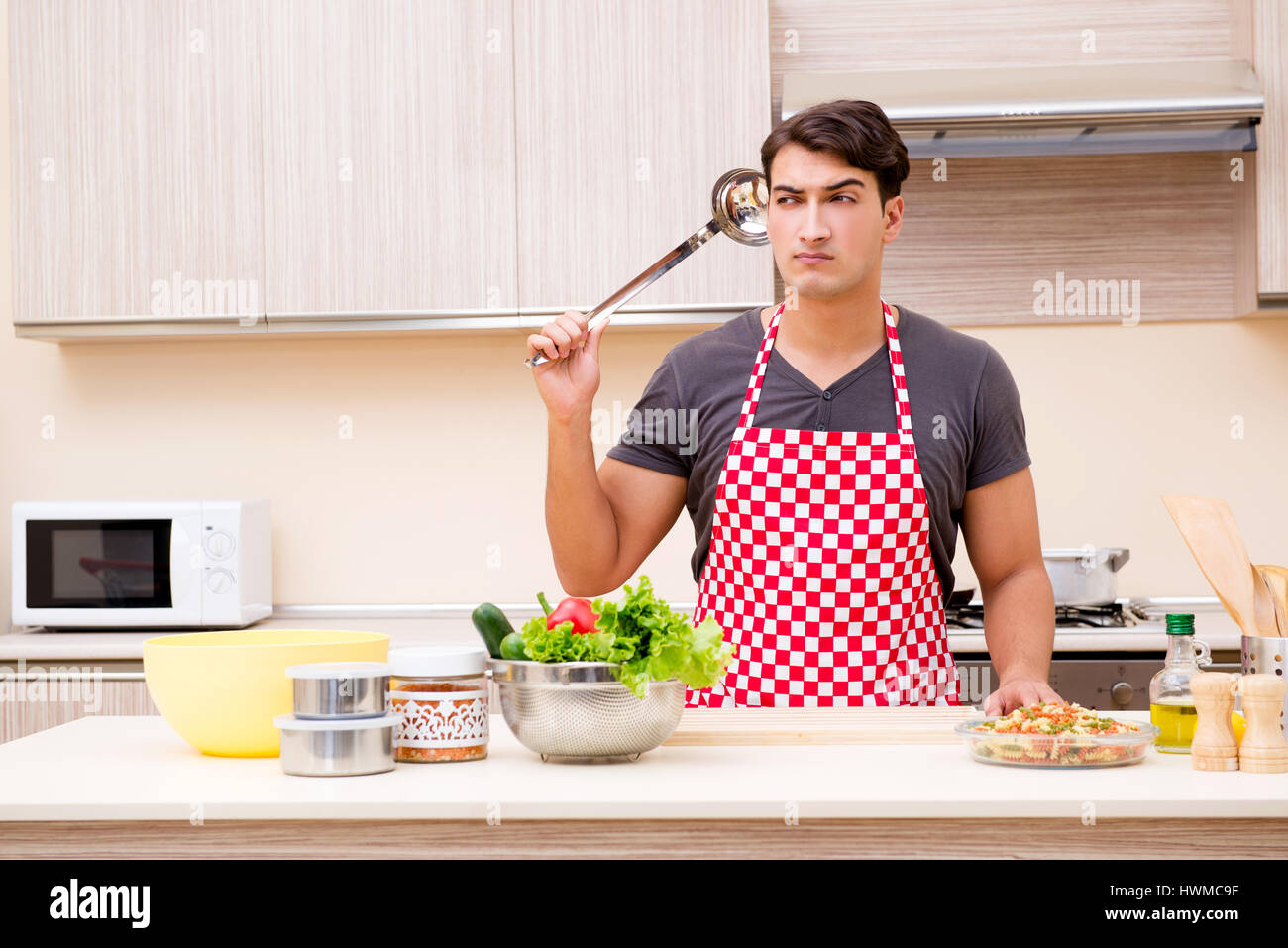 Man male cook preparing food in kitchen Stock Photo - Alamy
