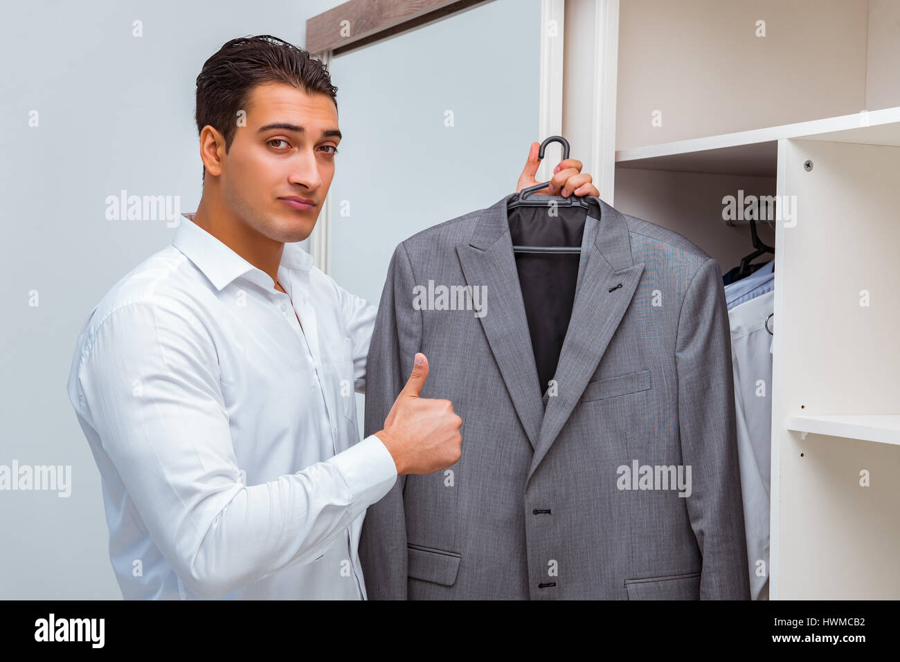 Businessman dressing up for work Stock Photo - Alamy