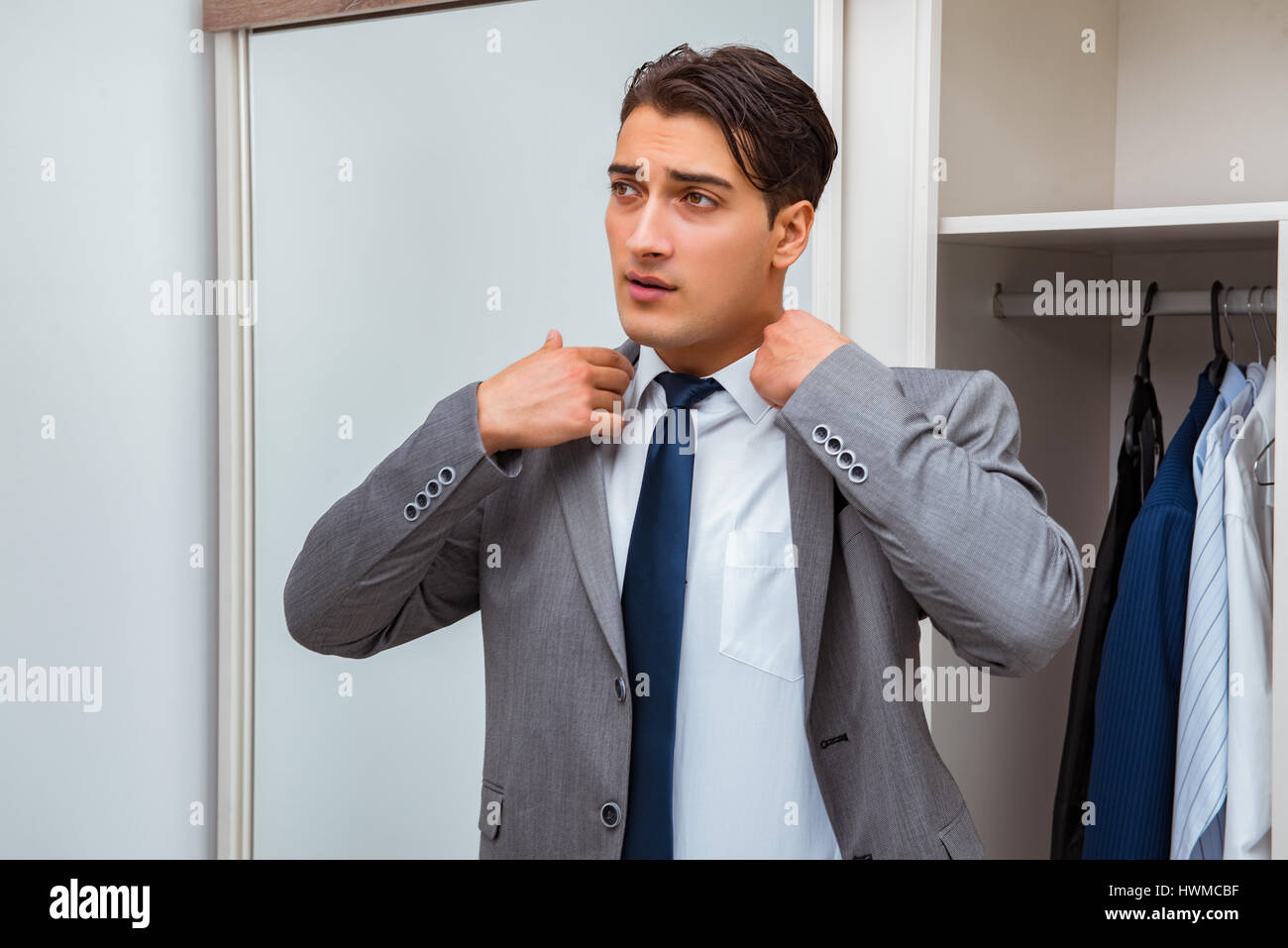 Businessman dressing up for work Stock Photo - Alamy