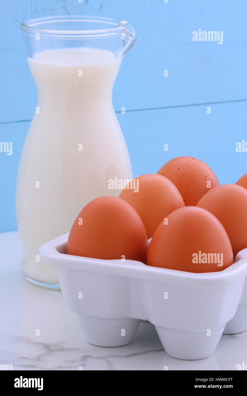 Fresh country-style dairy products. On vintage Italian carrara marble ...