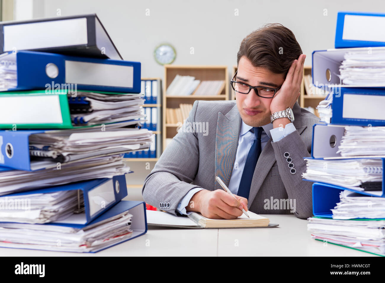 Busy businessman under stress due to excessive work Stock Photo - Alamy