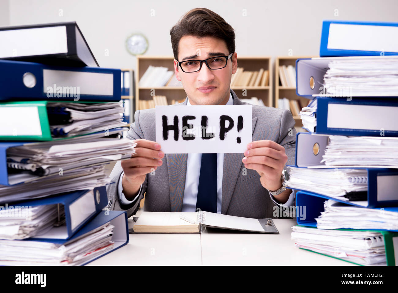 Busy businessman asking for help with work Stock Photo - Alamy