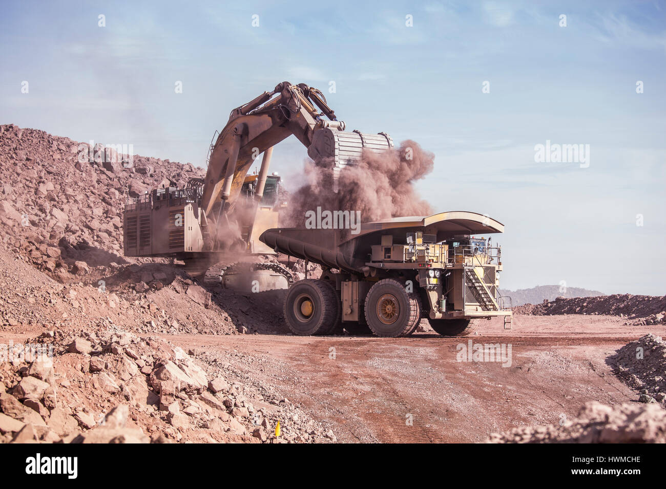 Loading of copper ore on very big dump-body truck Stock Photo - Alamy