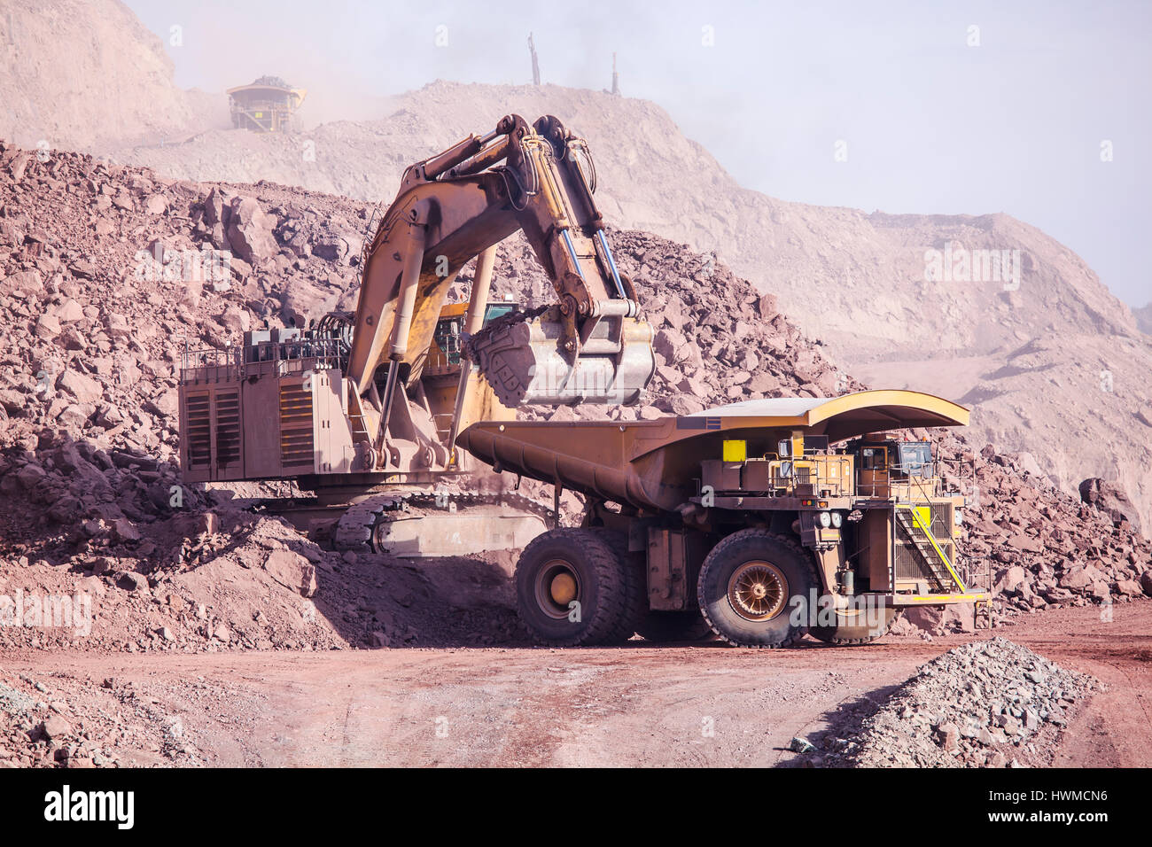 Loading of copper ore on very big dump-body truck Stock Photo - Alamy