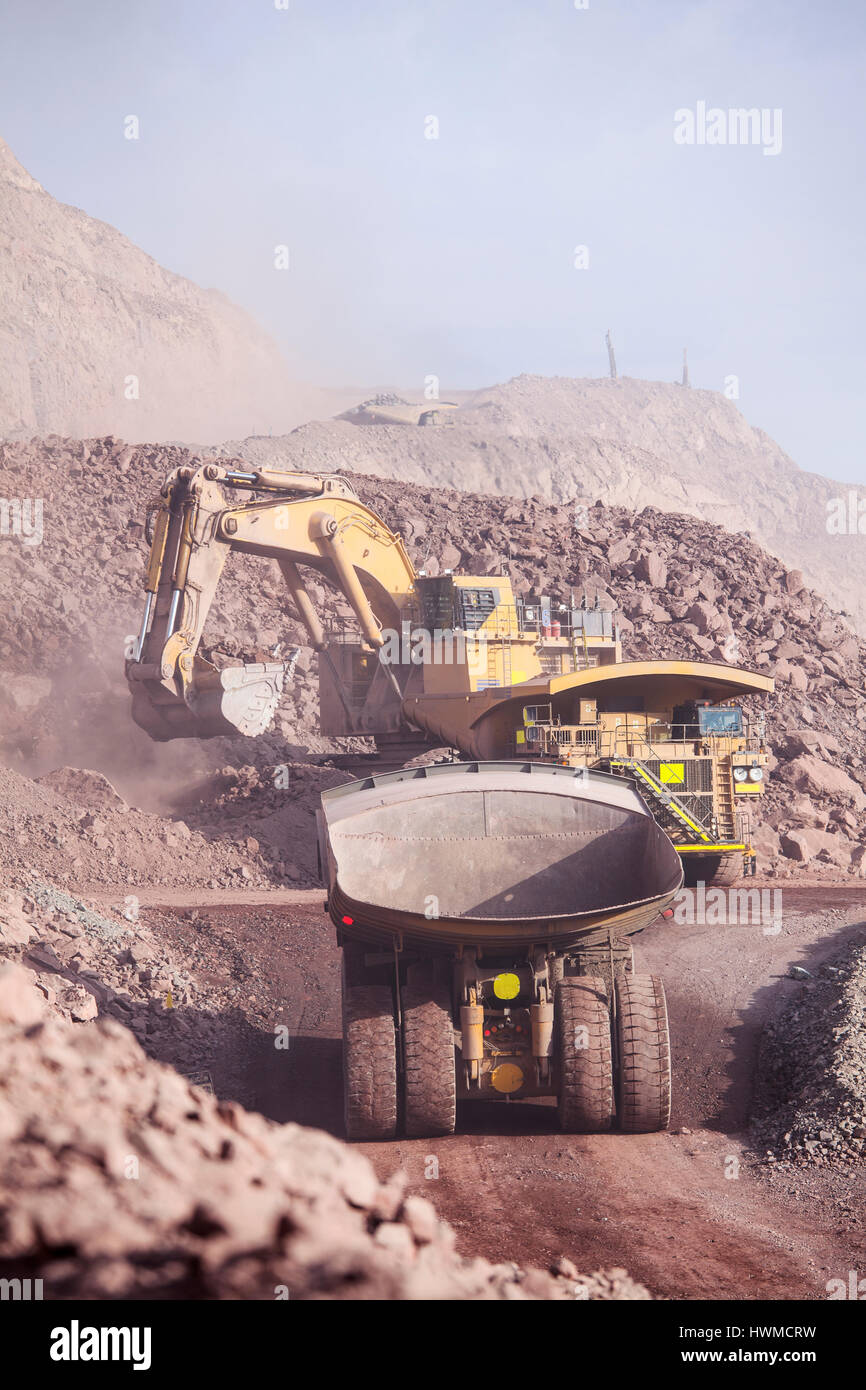 Loading of copper ore on very big dump-body truck Stock Photo - Alamy