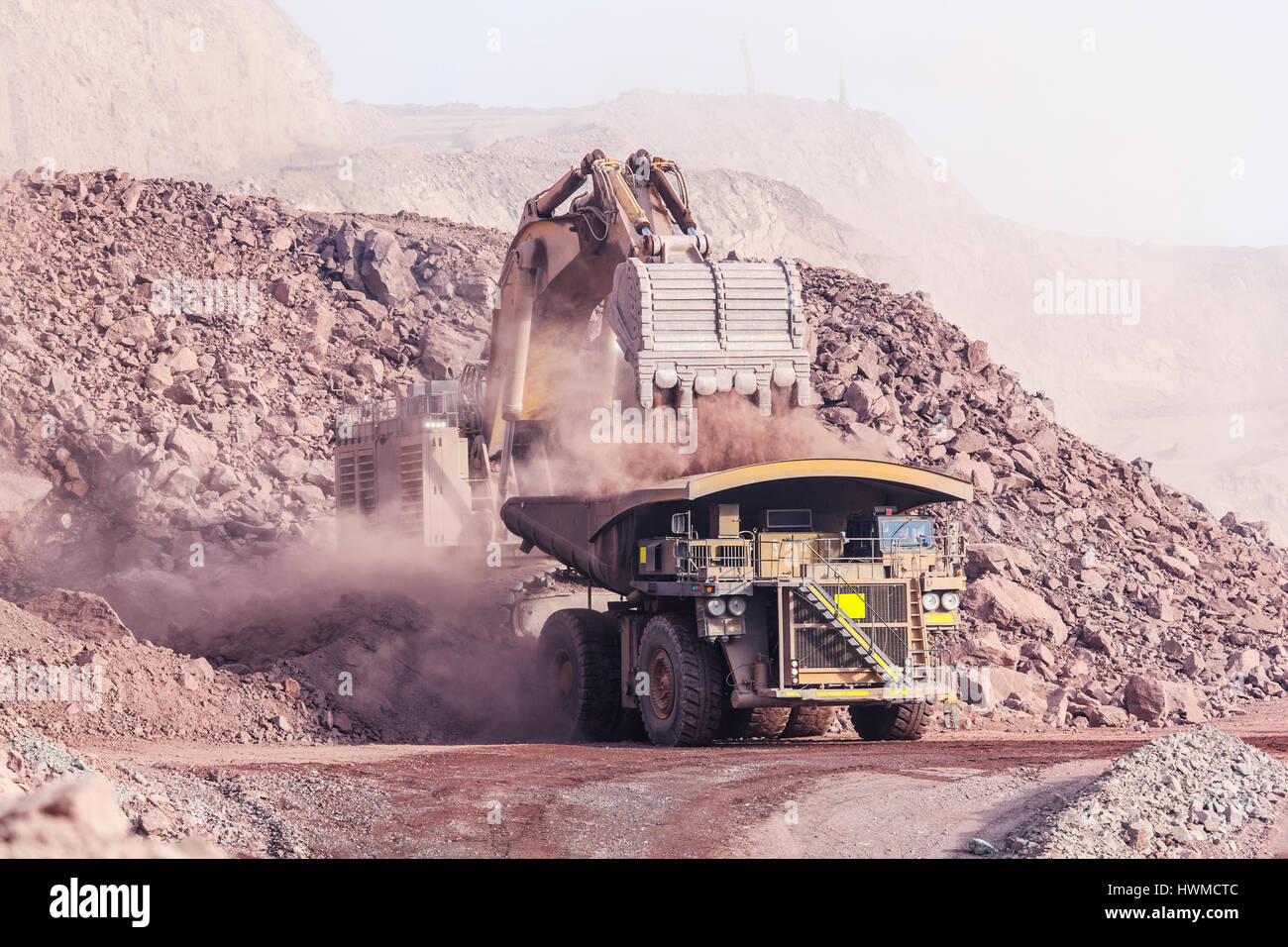 Loading of copper ore on very big dump-body truck Stock Photo - Alamy