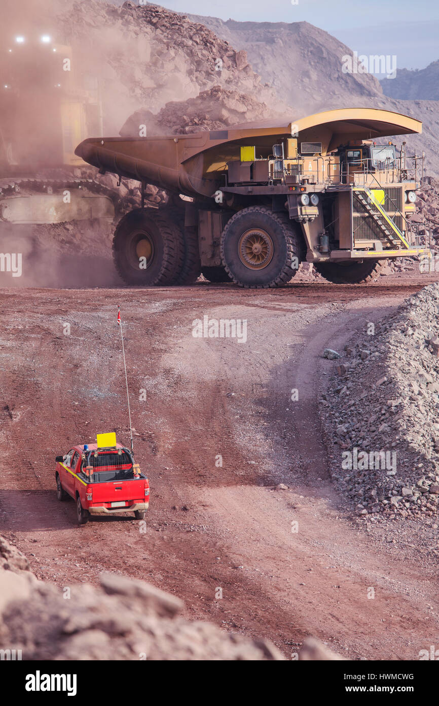 Loading of copper ore on very big dump-body truck Stock Photo - Alamy
