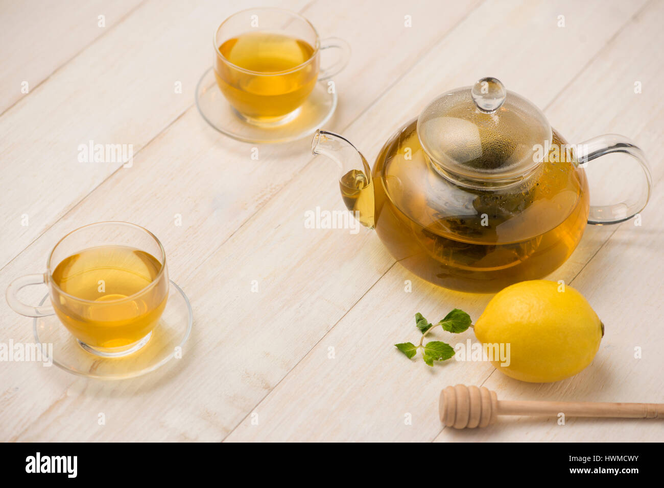 Cup of lemon tea with honey on white wooden background Stock Photo - Alamy