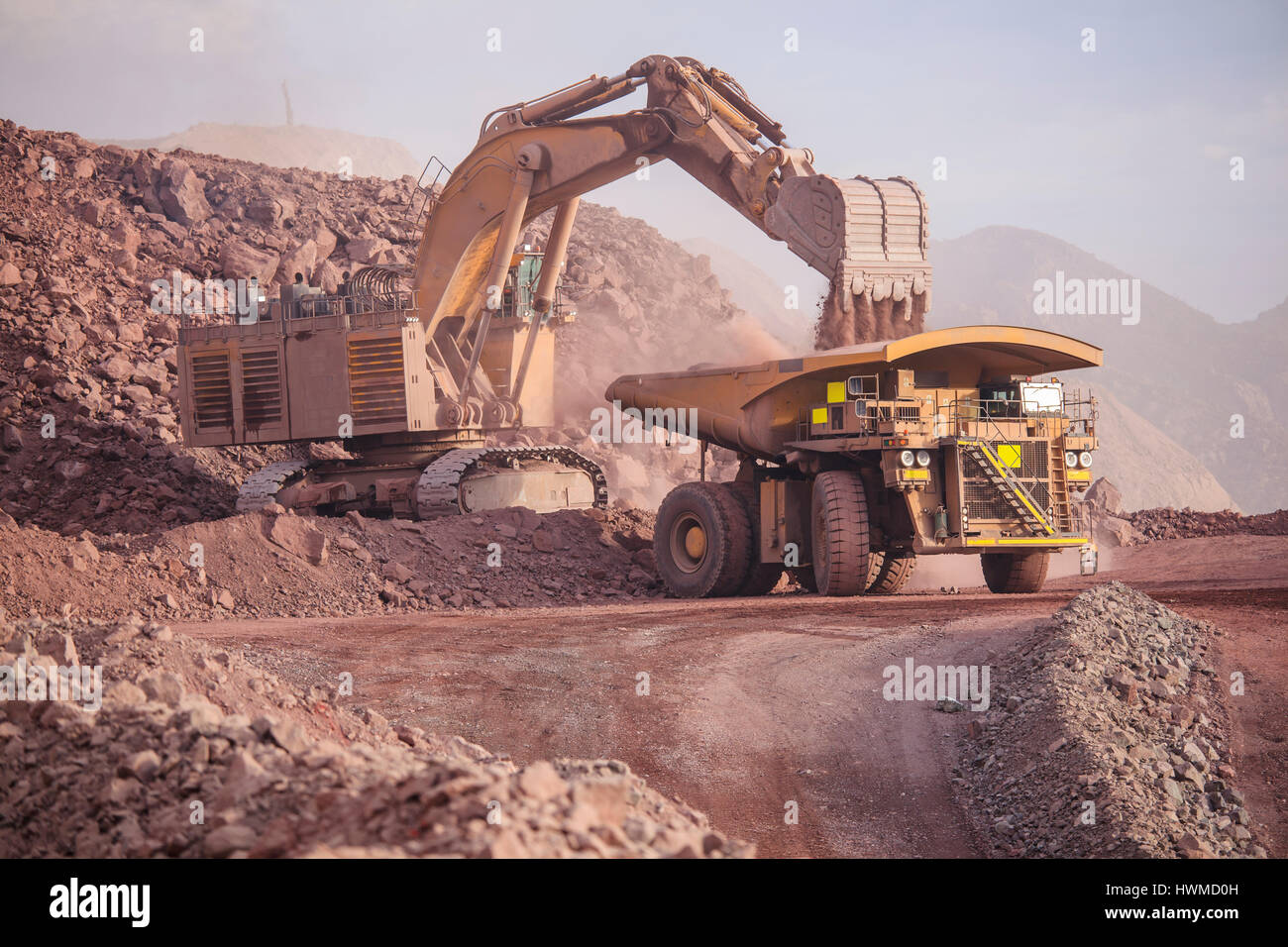 Loading of copper ore on very big dump-body truck Stock Photo - Alamy
