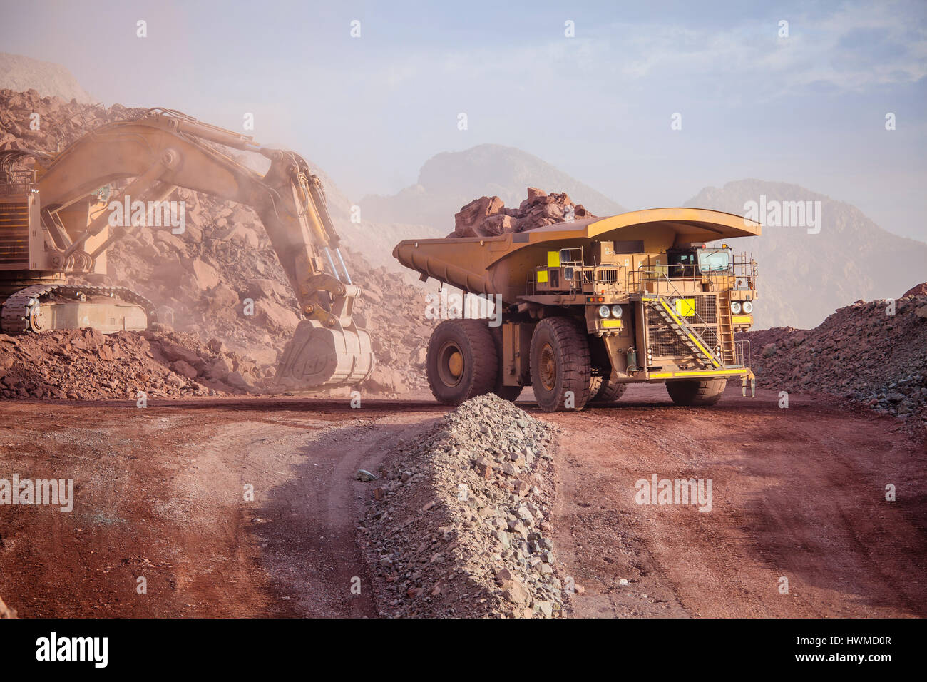 Loading of copper ore on very big dump-body truck Stock Photo - Alamy