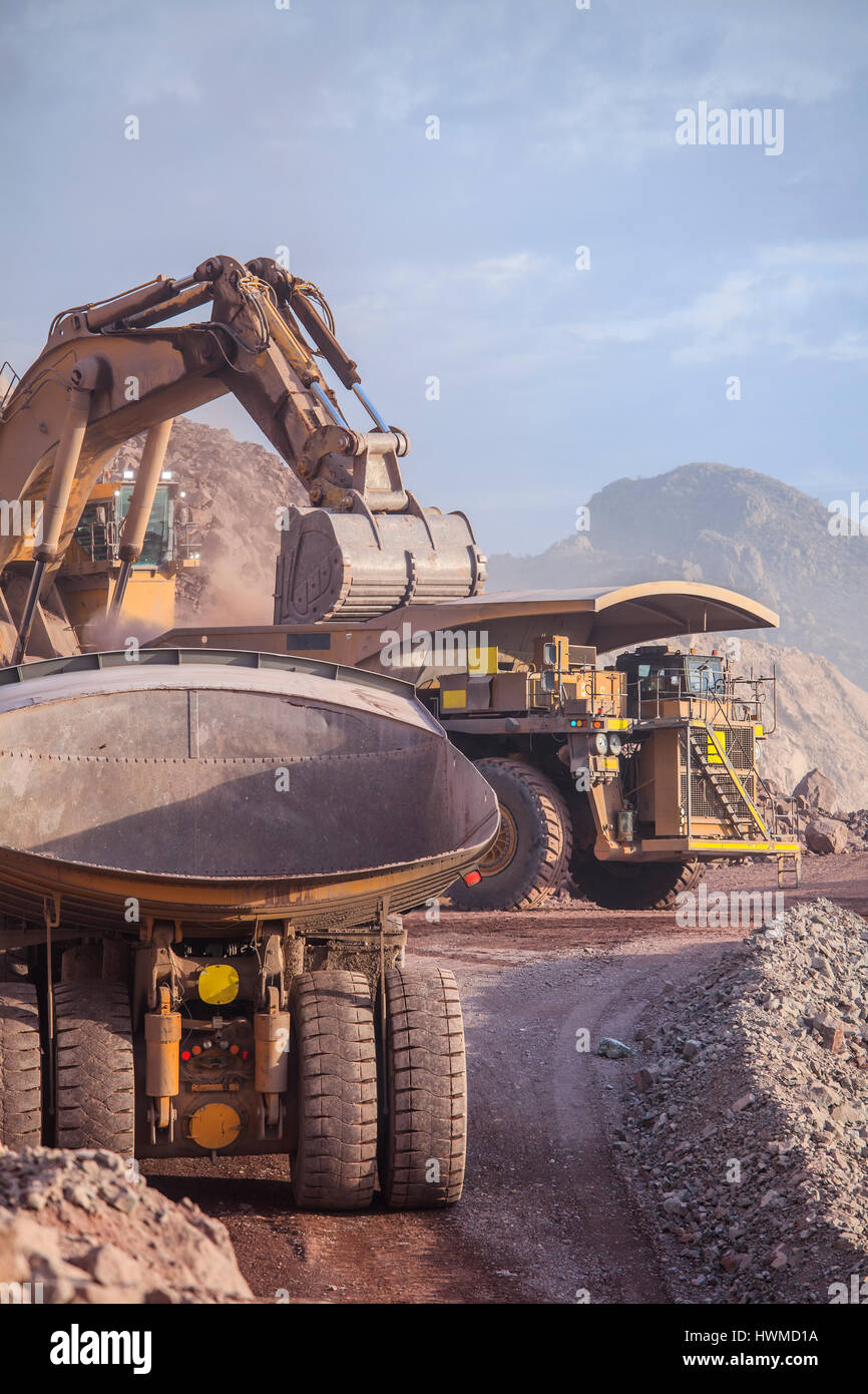 Loading of copper ore on very big dump-body truck Stock Photo - Alamy