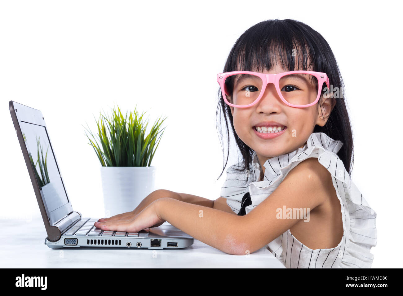 Smiling Asian Chinese little office lady using laptop in isolated white ...
