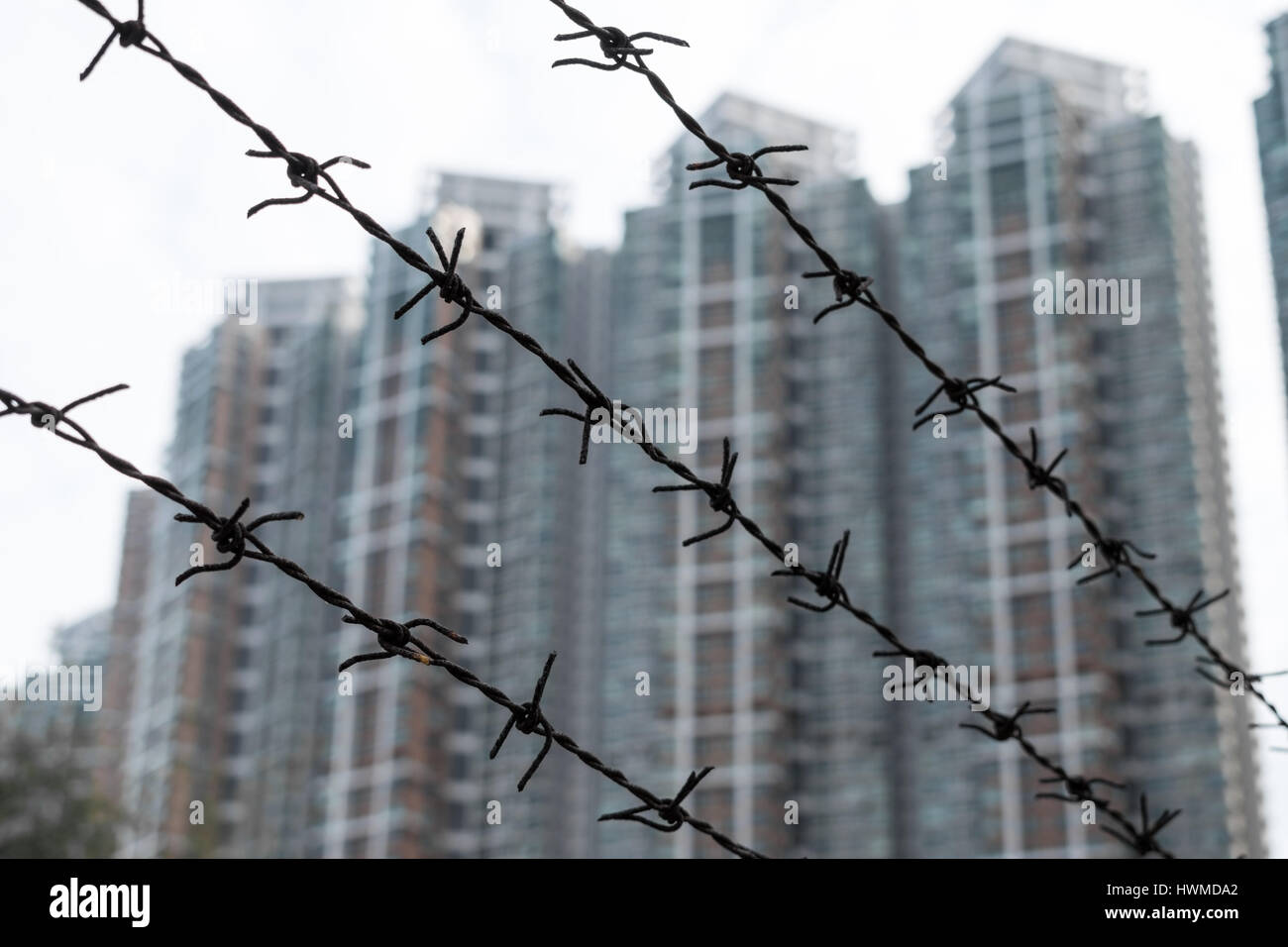 Barbed wires front housing hi-res stock photography and images - Alamy