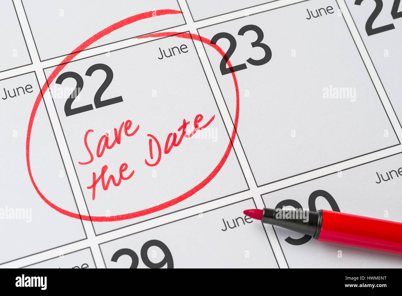 Save the Date written on a calendar - June 22 Stock Photo - Alamy