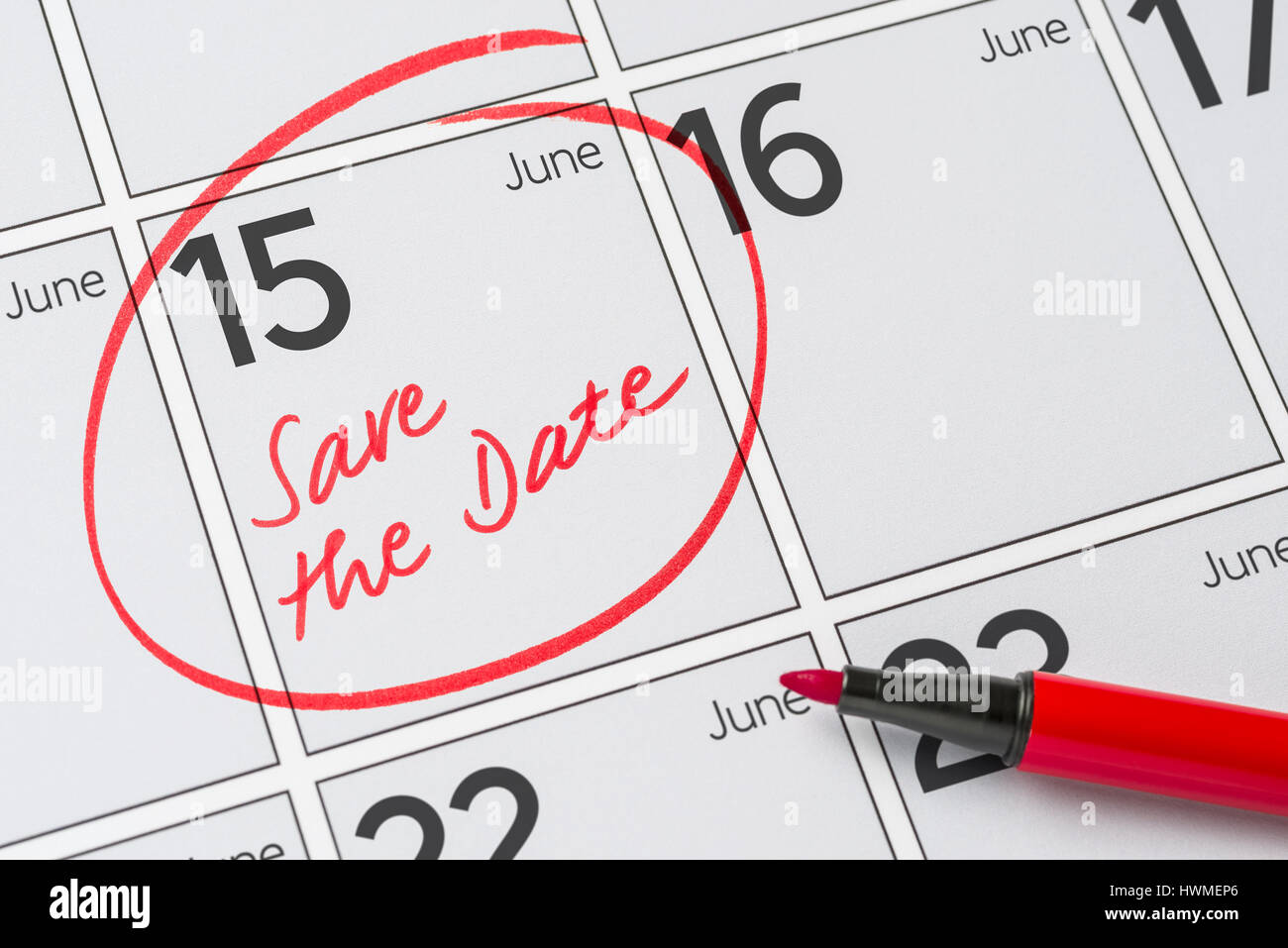 Save the Date written on a calendar - June 15 Stock Photo - Alamy