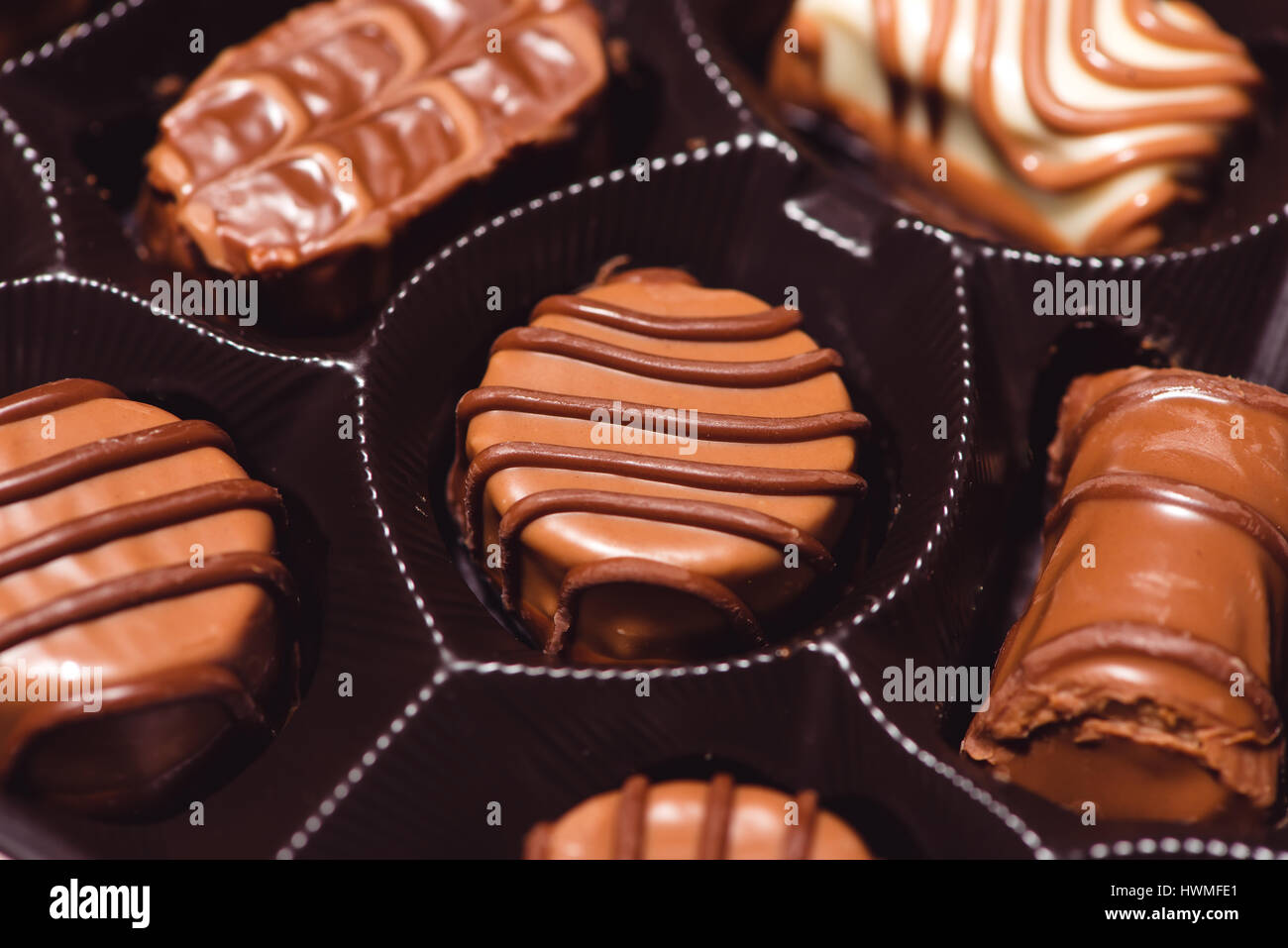 Close-up of variety chocolates in box Stock Photo - Alamy