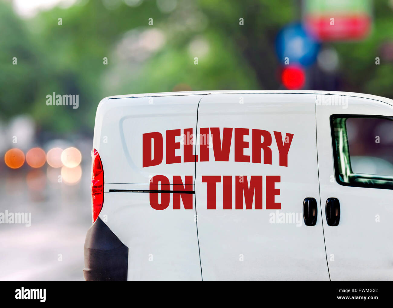 Free delivery, van on city street Stock Photo - Alamy