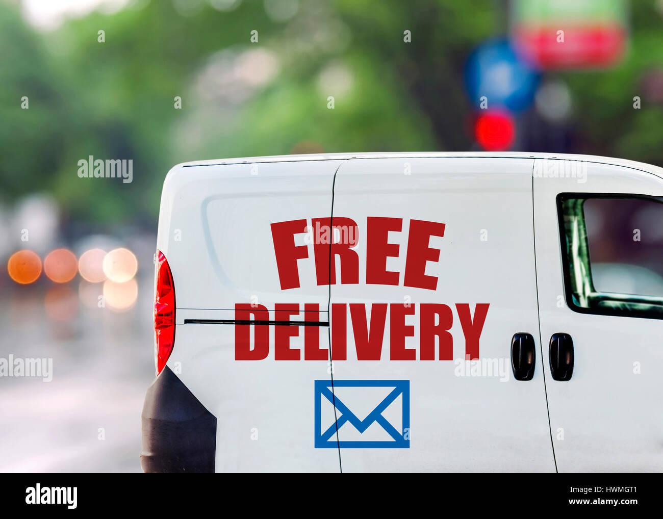 Free delivery, van on city street Stock Photo - Alamy