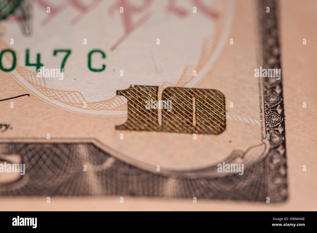 Gold ten on the banknote Stock Photo - Alamy