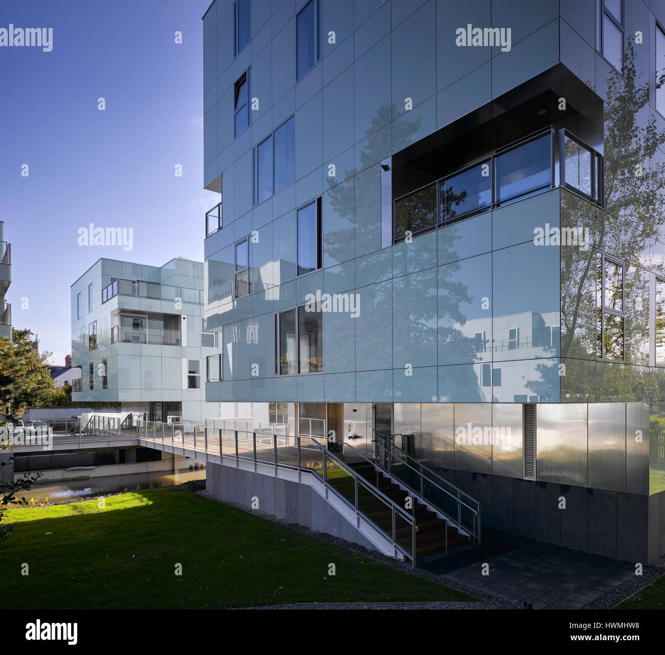 View of exterior facade showing reflective glass cladding and walkway ...