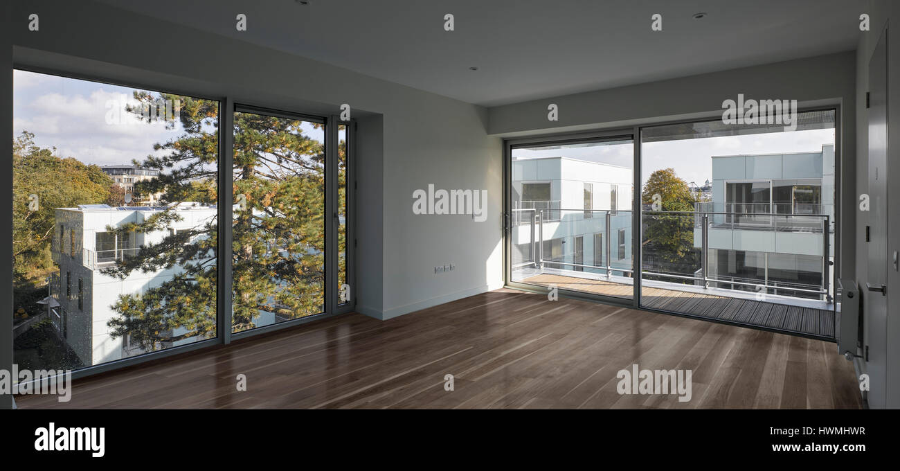 Interior third floor apartment showing glass sliding doors to exterior ...