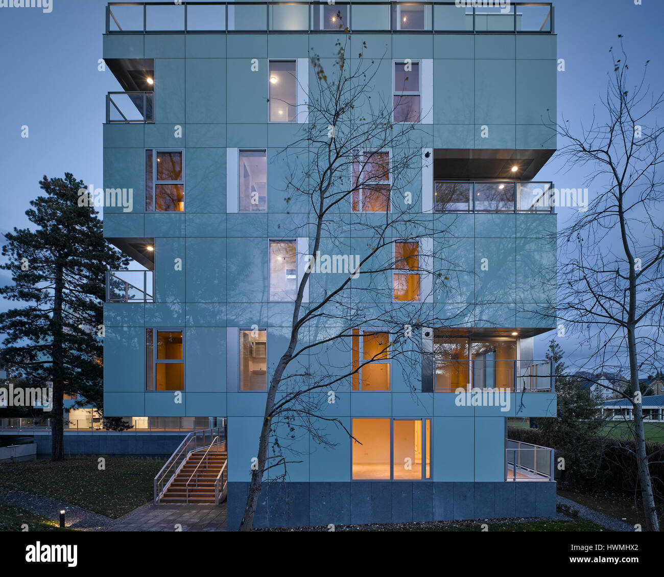 Dusk view of exterior showing stairway and lit interior. Dunluce ...