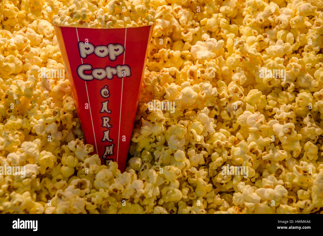 A cone full of Popcorn in different flavors Stock Photo - Alamy