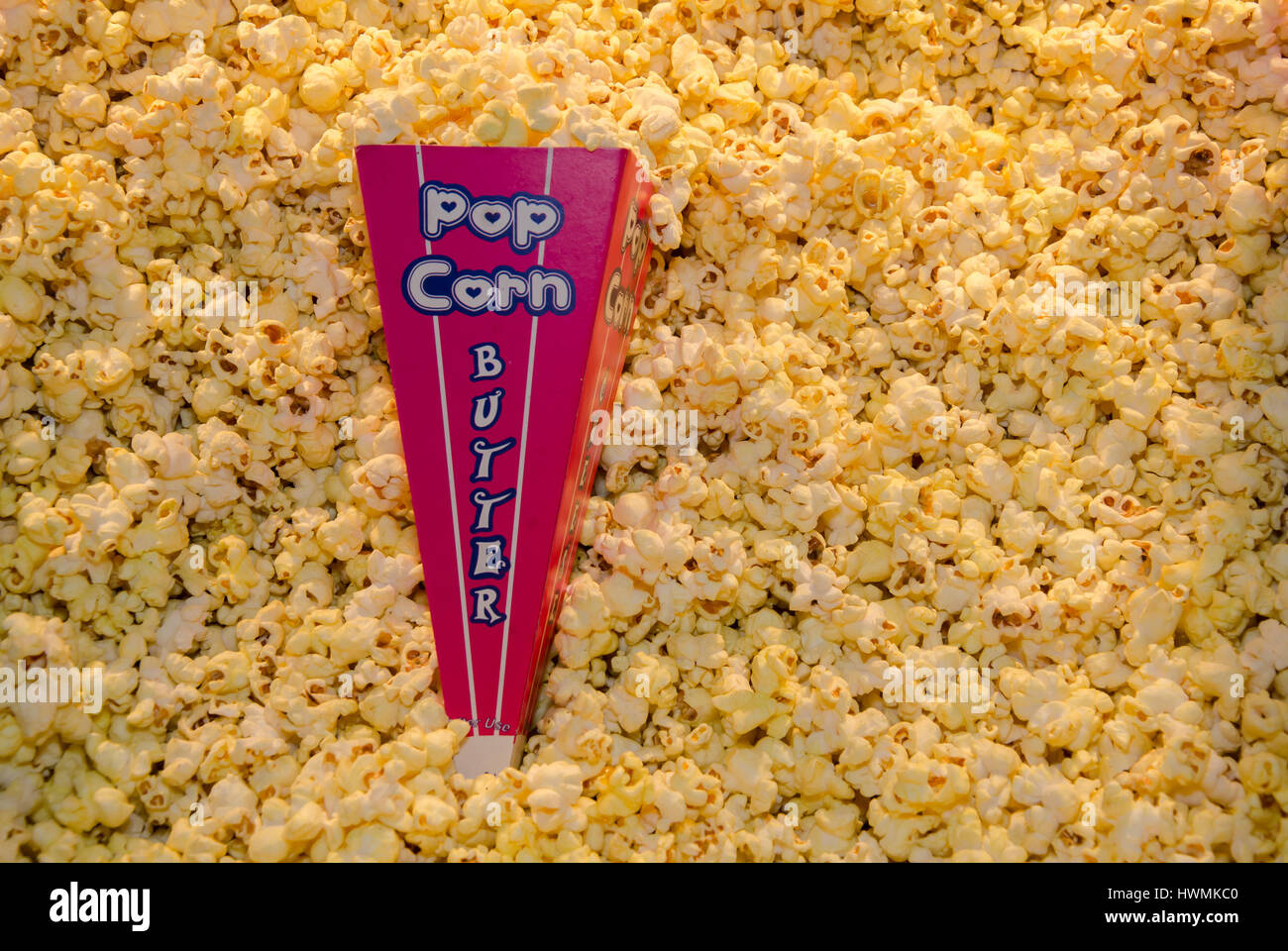 A cone full of Popcorn in different flavors Stock Photo - Alamy