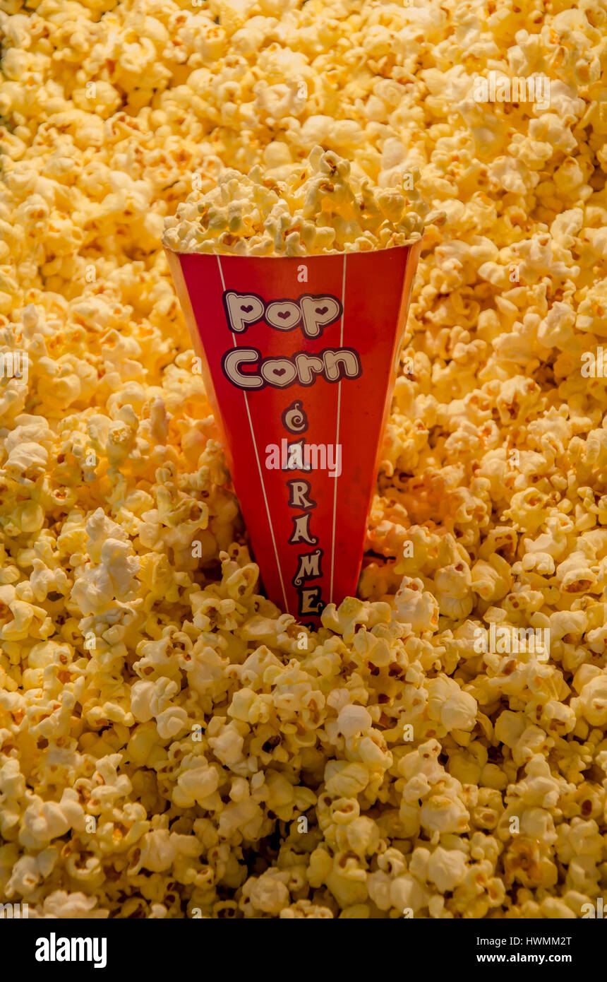 A cone full of Popcorn in different flavors Stock Photo - Alamy