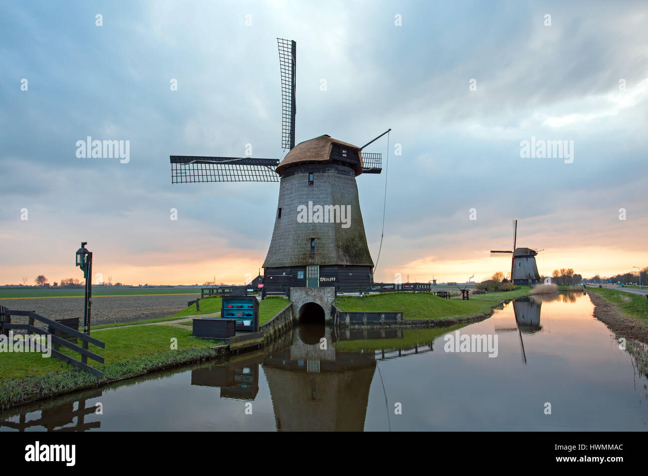 Medieval windmills in the countryside from the Netherlands at twilight ...