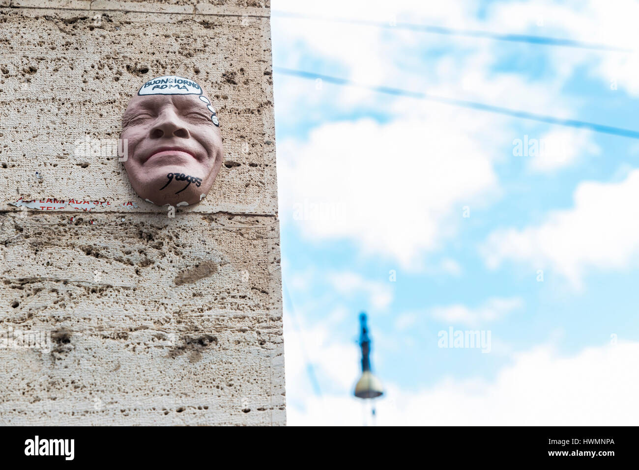 Rome, Italy - January 1, 2017: Smiling face graffiti giving good ...