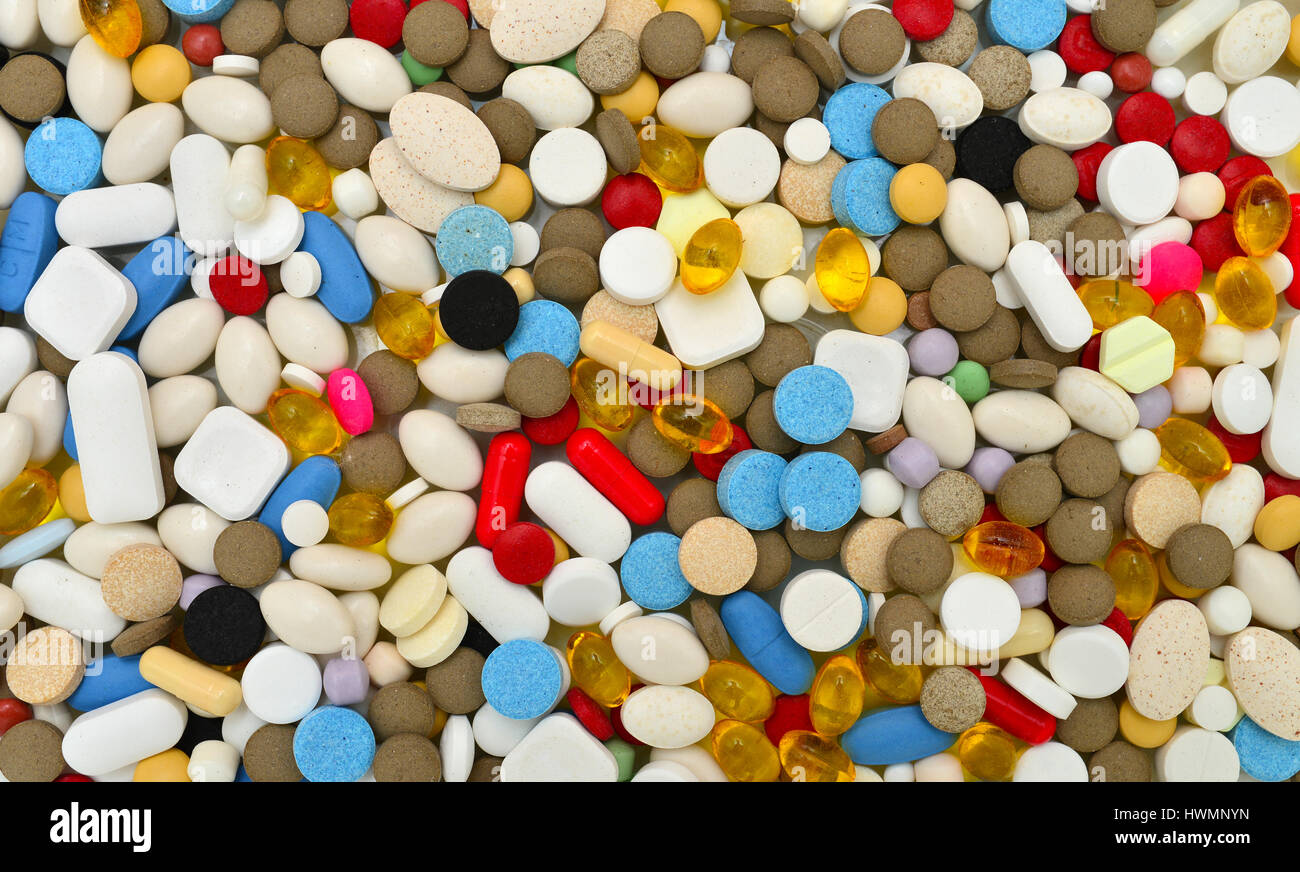 various colors pills texture background drugs pattern Stock Photo - Alamy