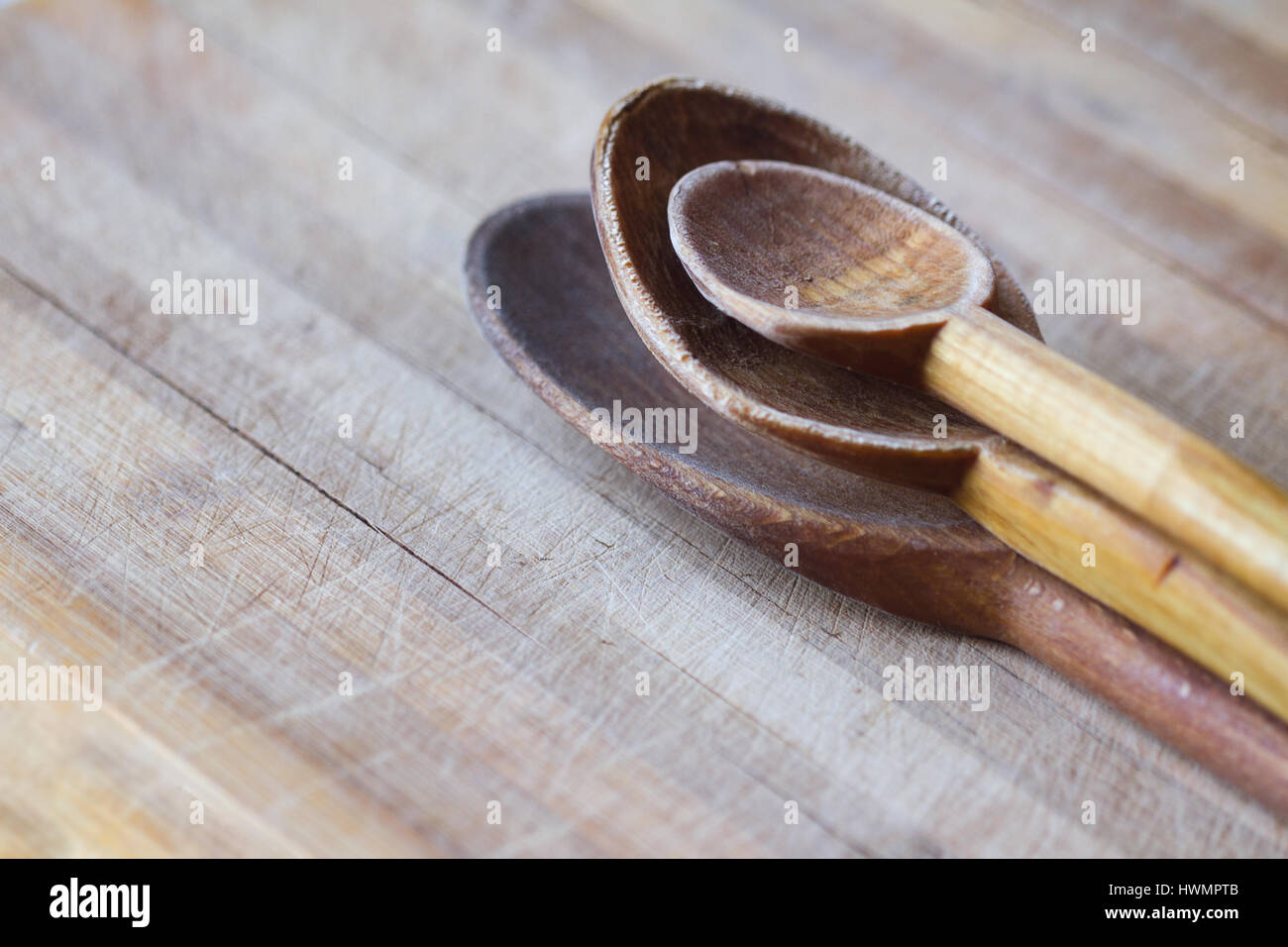 side view of hand crafted wooden kitchen spoons in many sizes and ...
