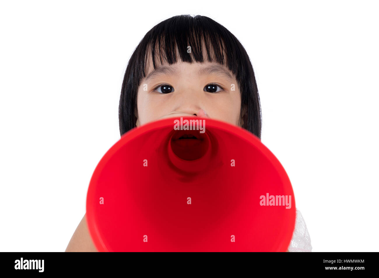 Asian Chinese little girl shouting with retro loudspeaker in isolated ...