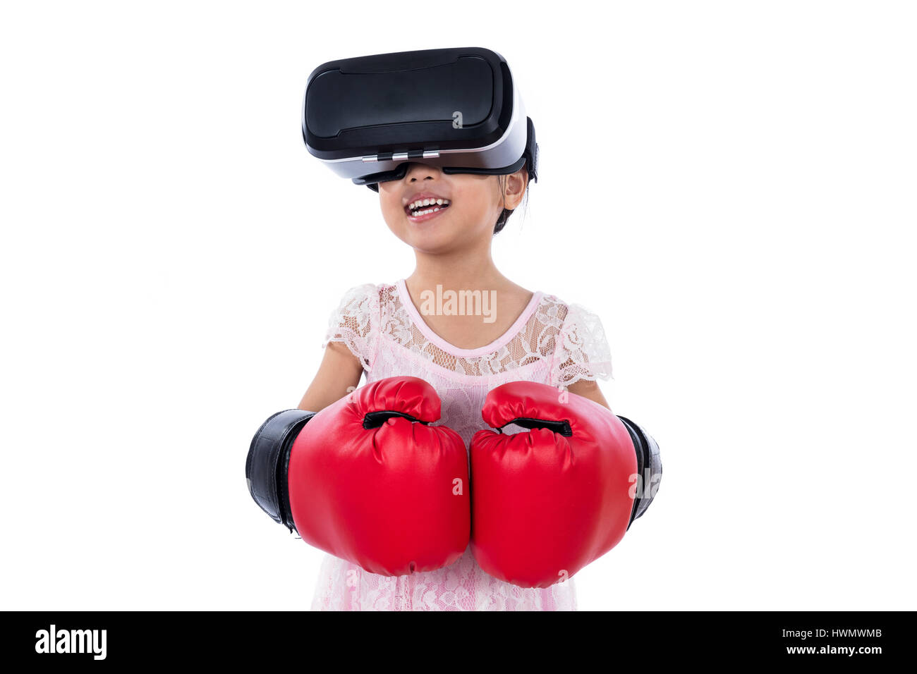 Asian Chinese little girl experiencing virtual reality with boxing ...