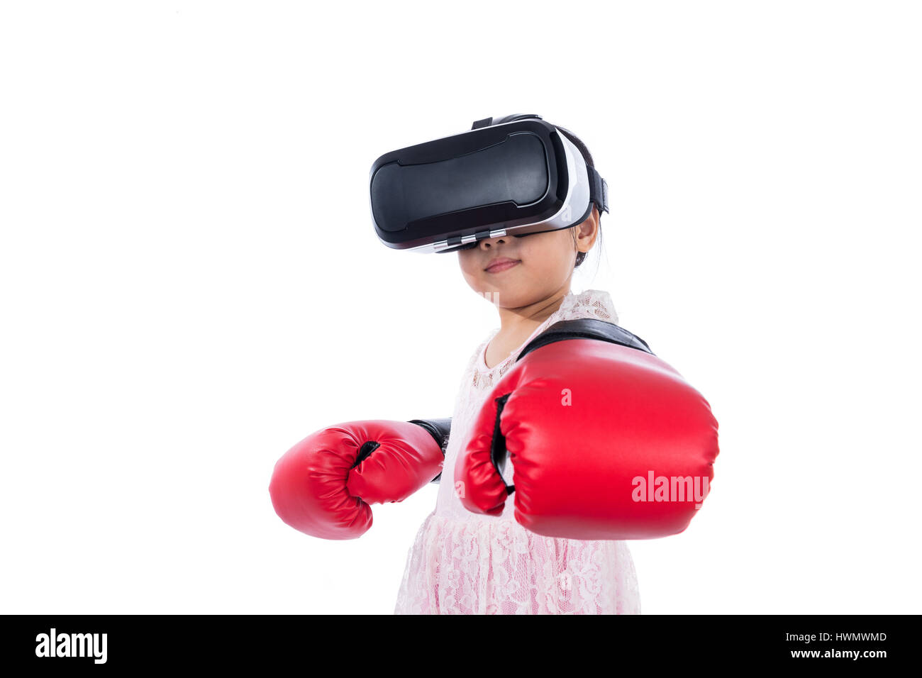 Asian Chinese little girl experiencing virtual reality with boxing ...