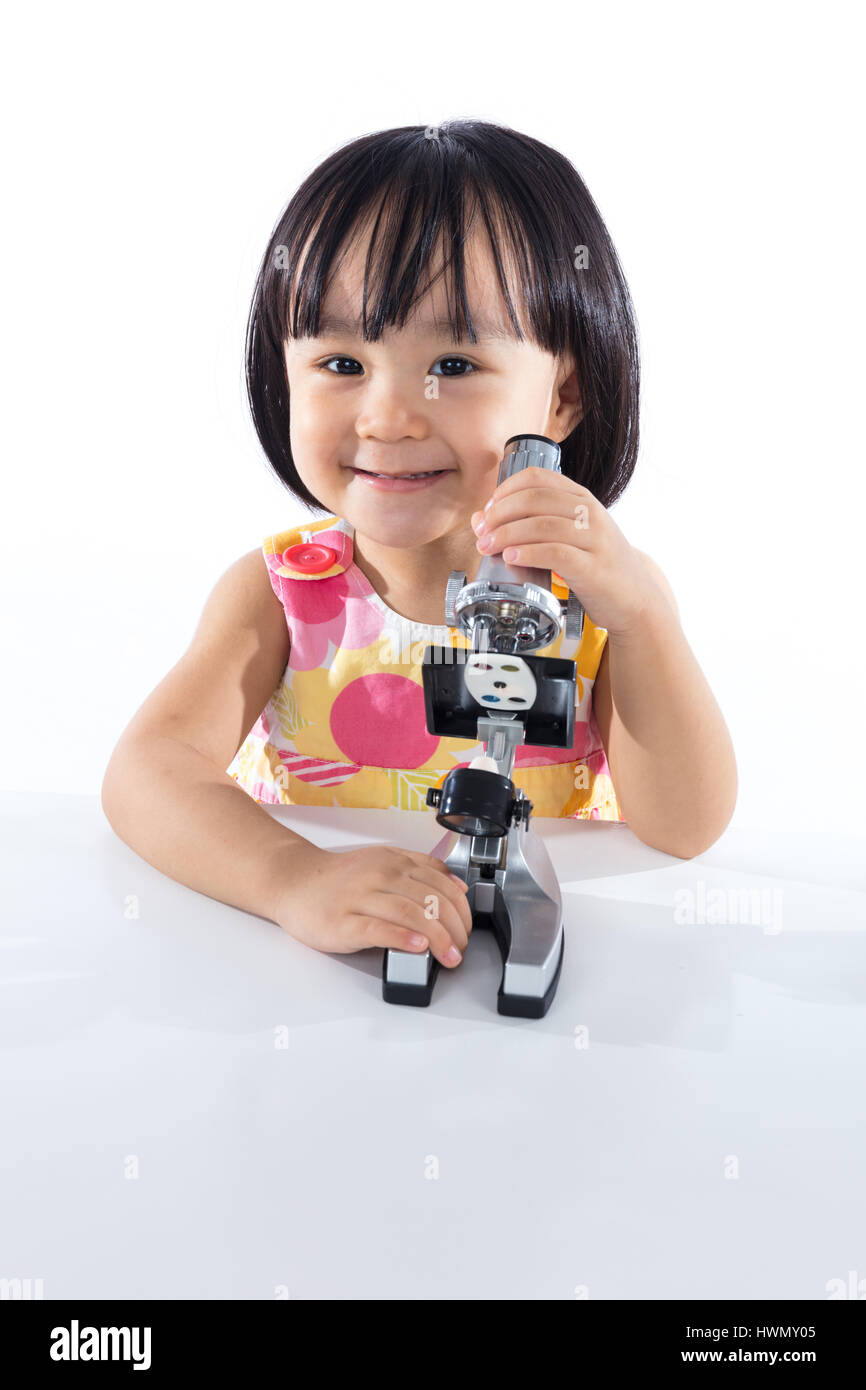 Happy Asian Chinese little girl with microscope in isolated white ...