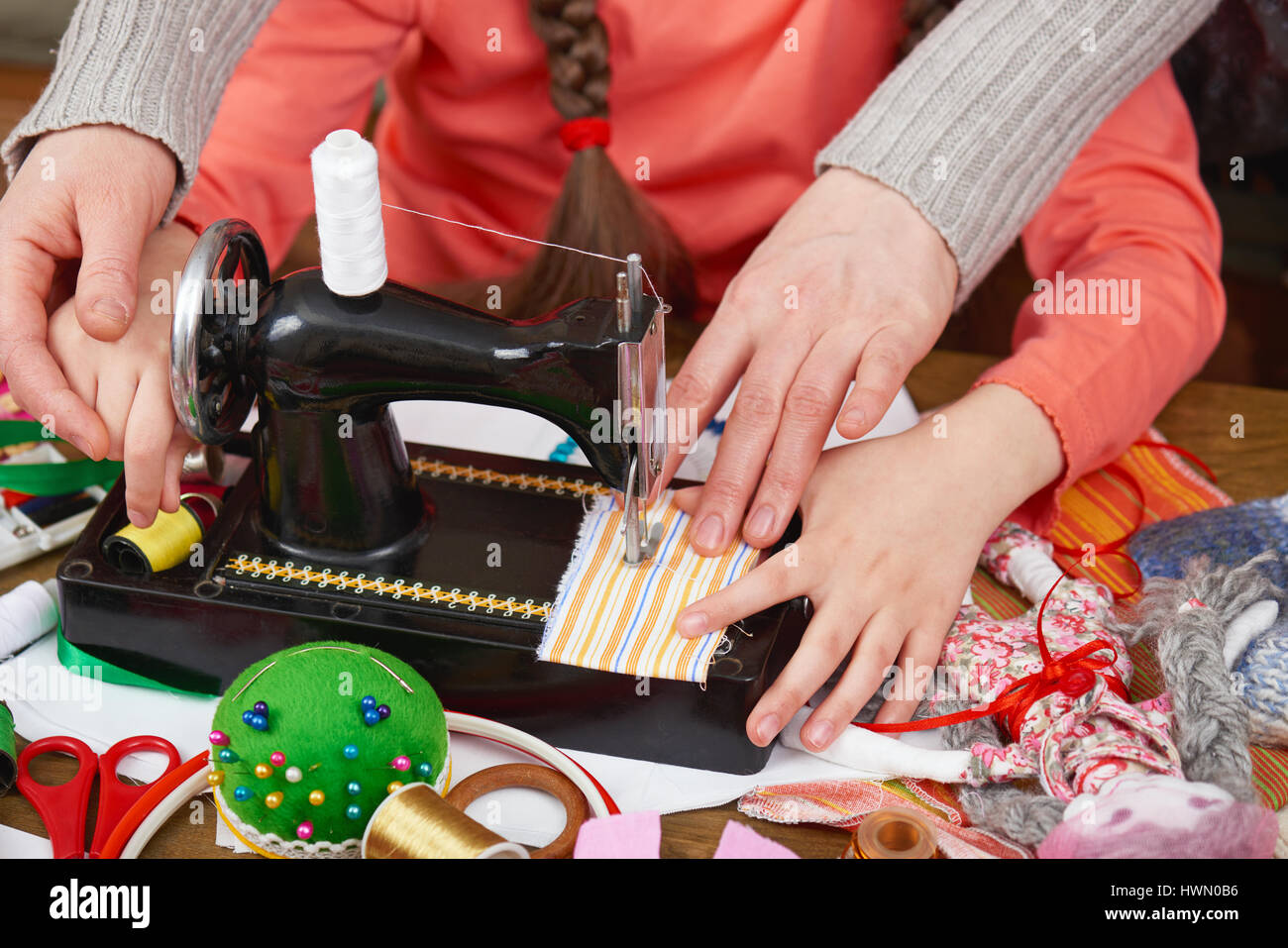mother teaching daughter girl sew, job training, handmade and ...