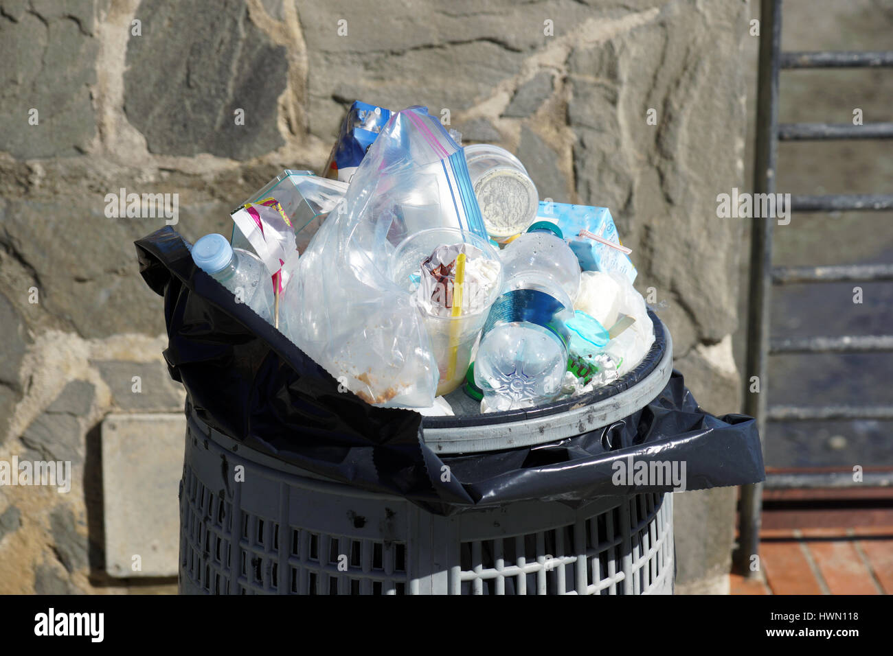 Full garbage basket Stock Photo - Alamy