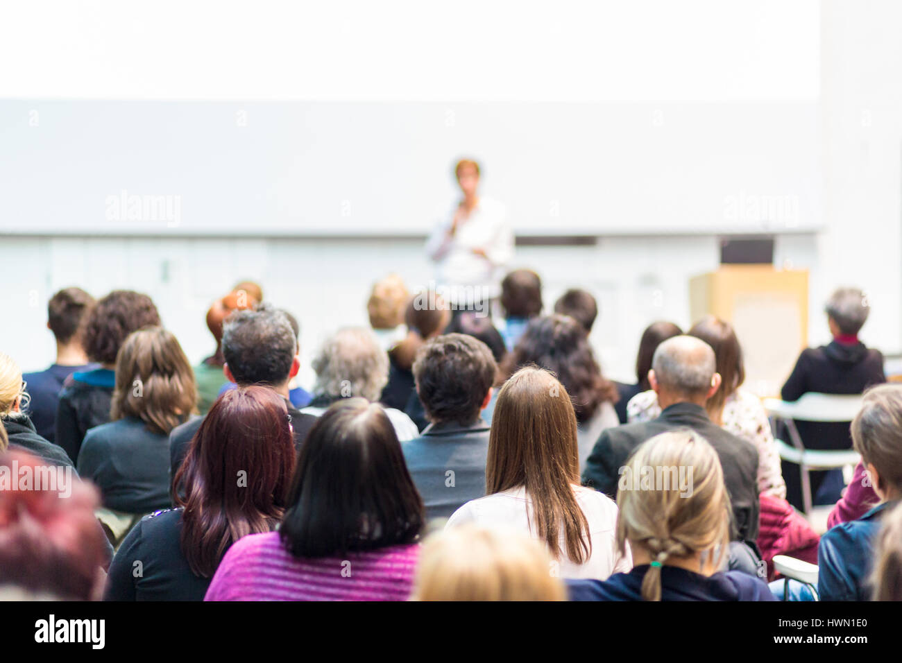 Woman giving presentation on business conference Stock Photo - Alamy