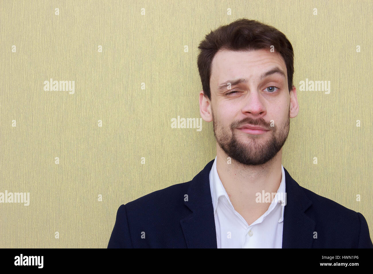 Handsome young business man smiling Stock Photo - Alamy