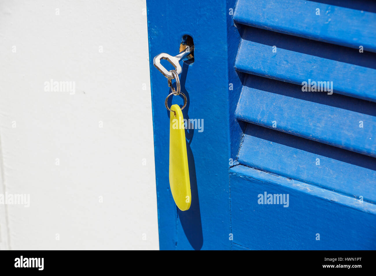 Key in keyhole on door Stock Photo - Alamy